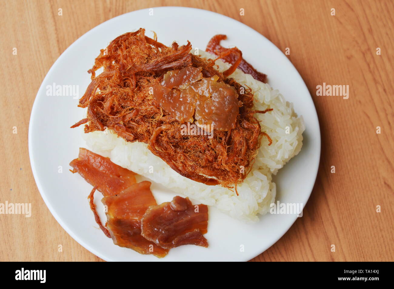 crispy shredded pork topping on sticky rice Stock Photo - Alamy