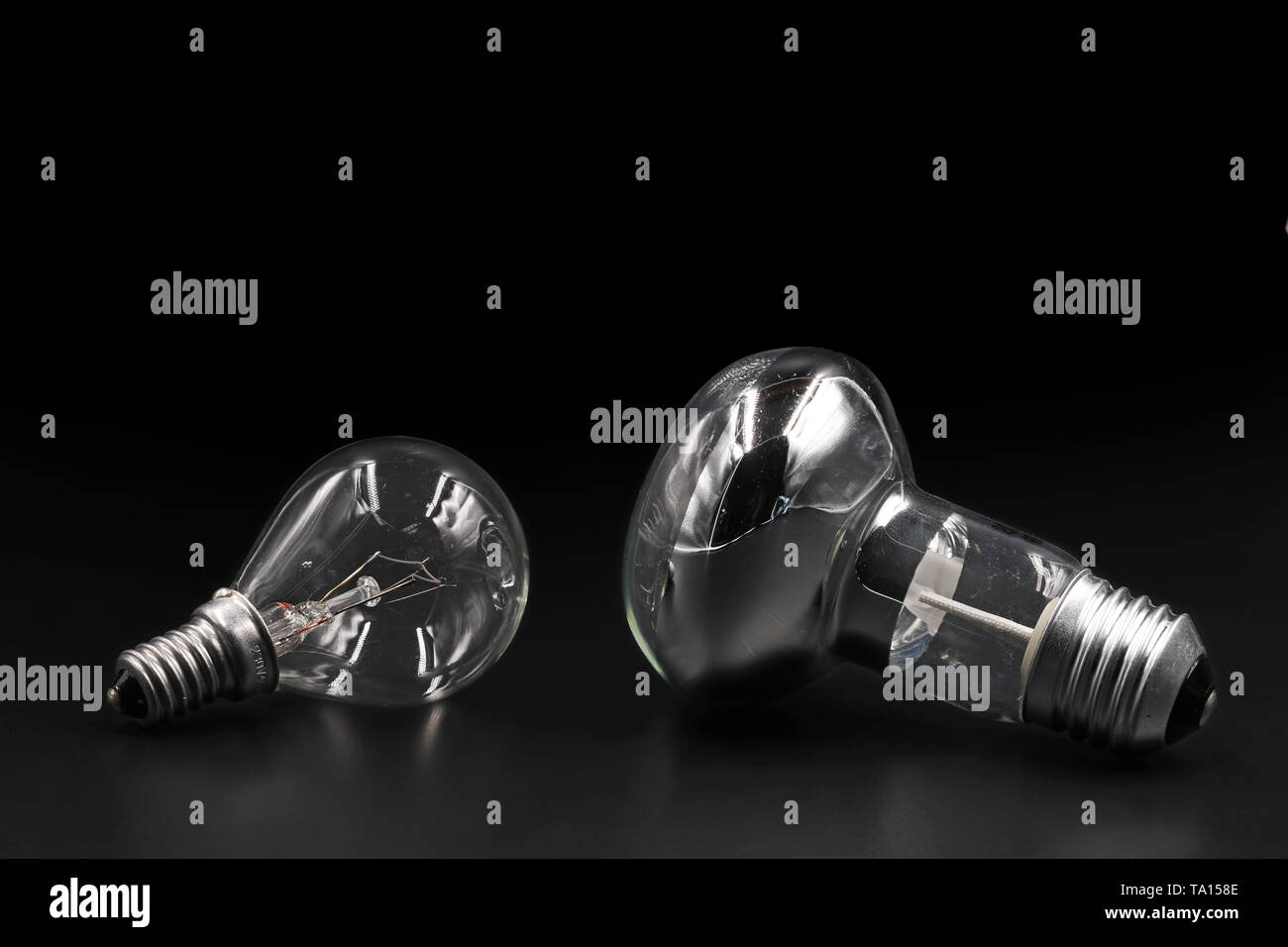 Two types of light bulbs on black background with copy space Stock ...