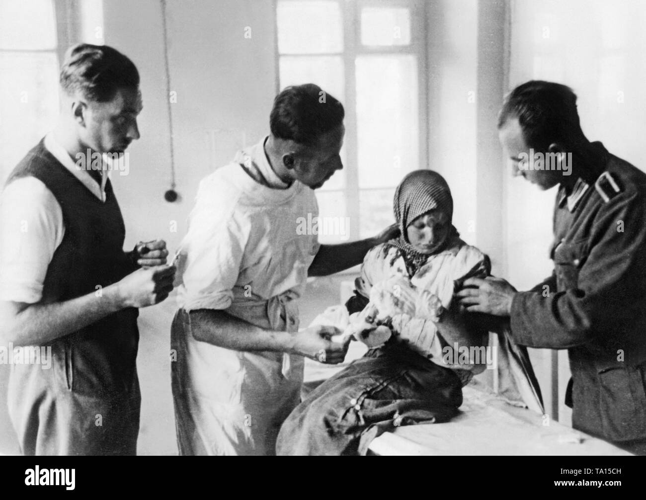 A girl wounded by shrapnel is being treated by German doctors in ...