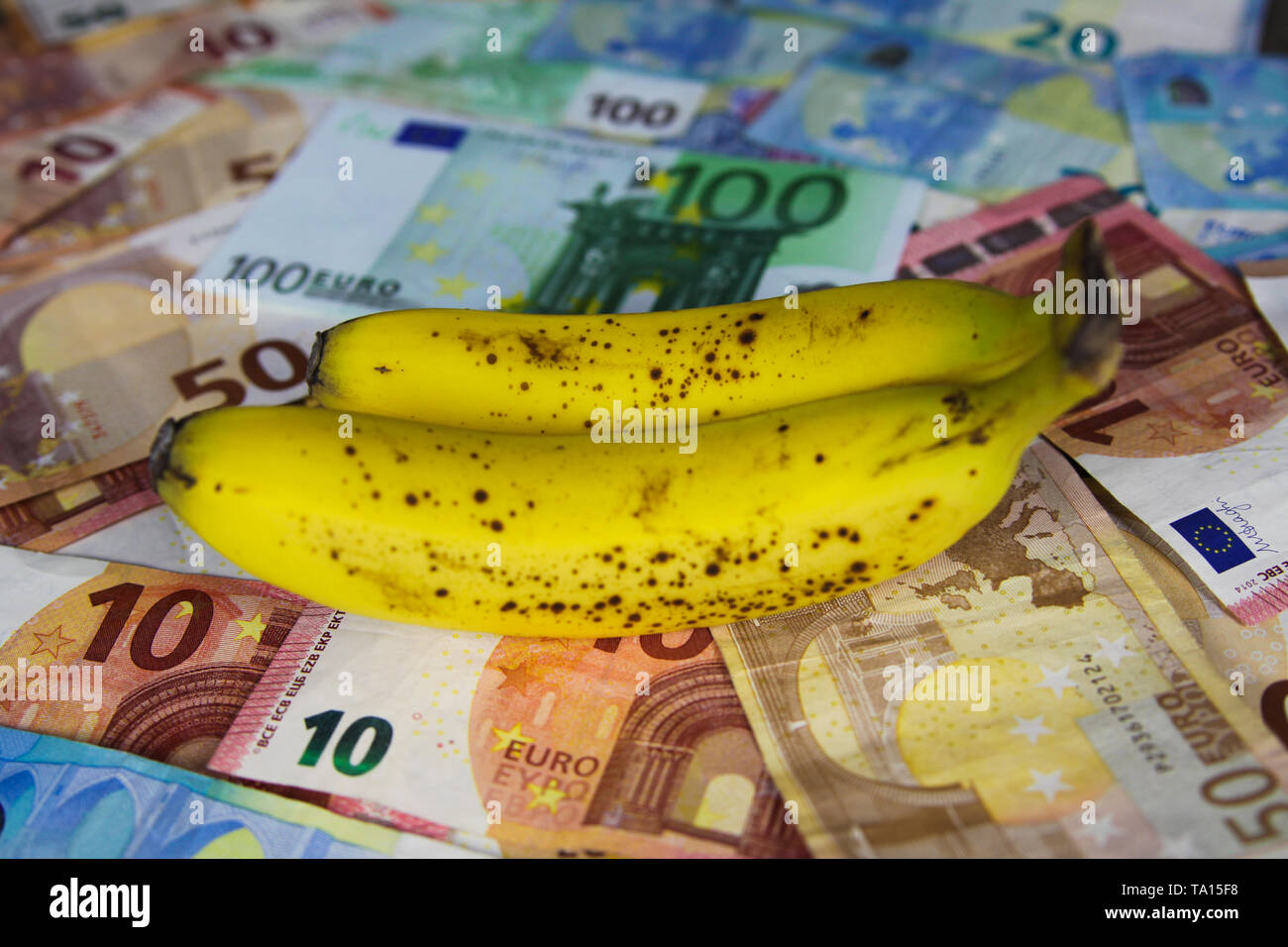 Balanced healthy nutrition cost concept - Two yellow and brown ripe ...