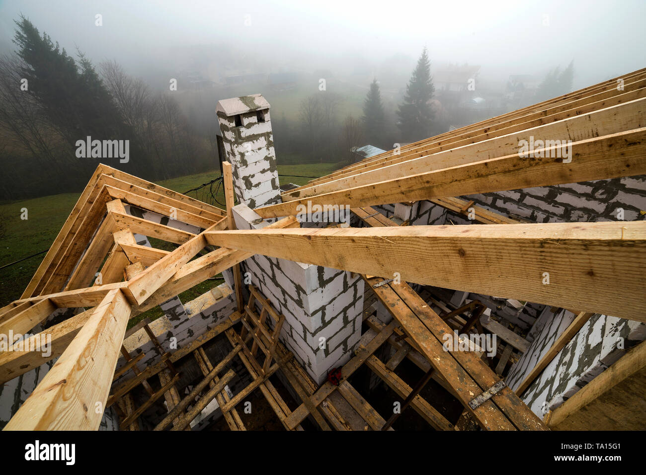 Top view of roof frame from wooden lumber beams and planks on walls ...