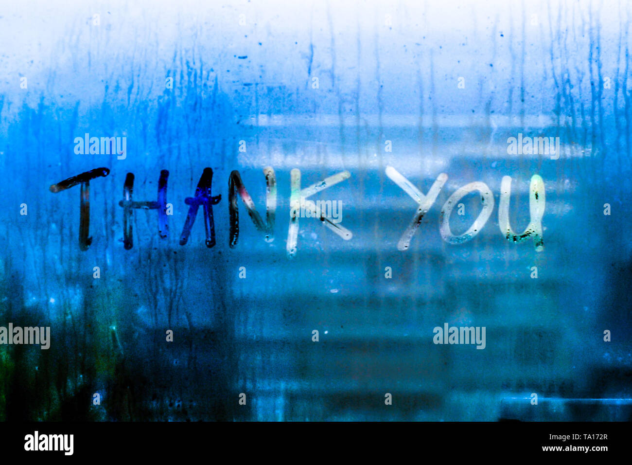 Thank you words rain drops water drops written wrie on window glass ...