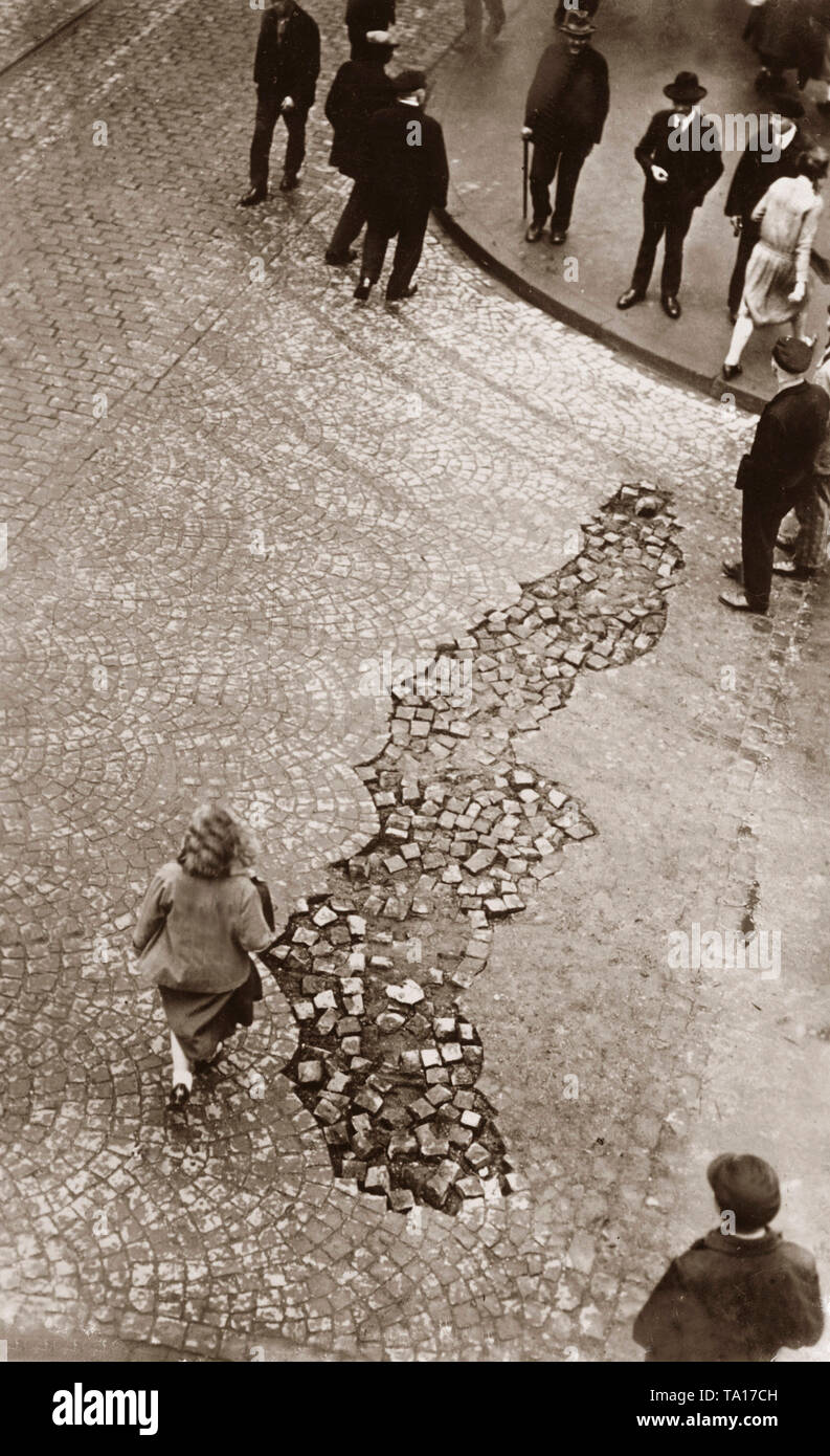 In a street battle with the police, Communists used paving stones for ...