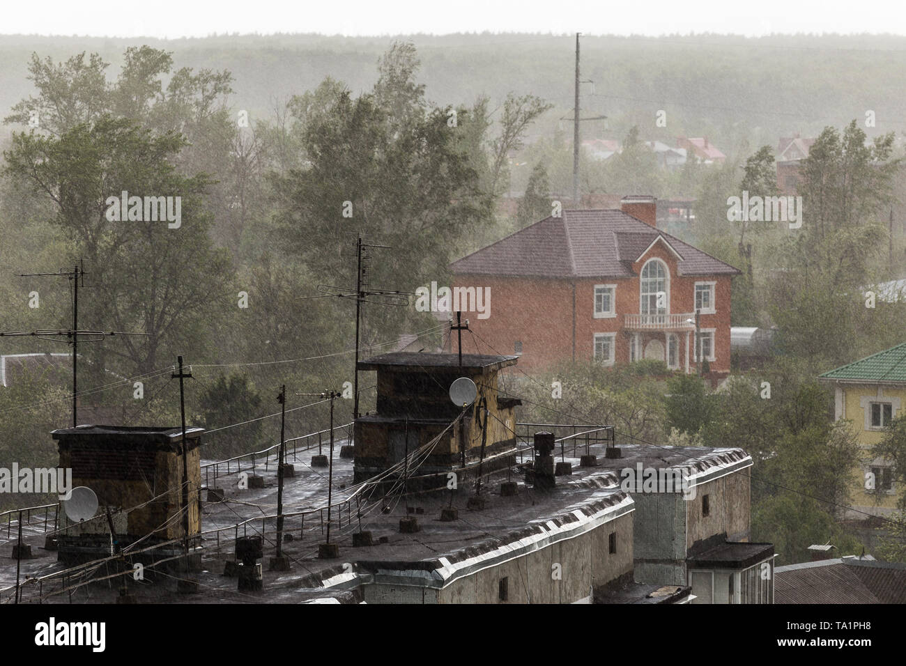 russian suburbs roofs under heavy rain telephoto shot Stock Photo - Alamy