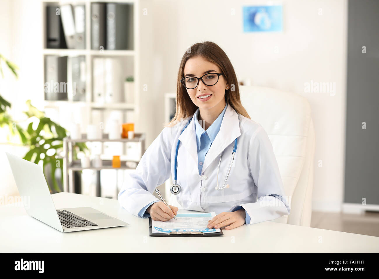 Female doctor working in clinic Stock Photo - Alamy
