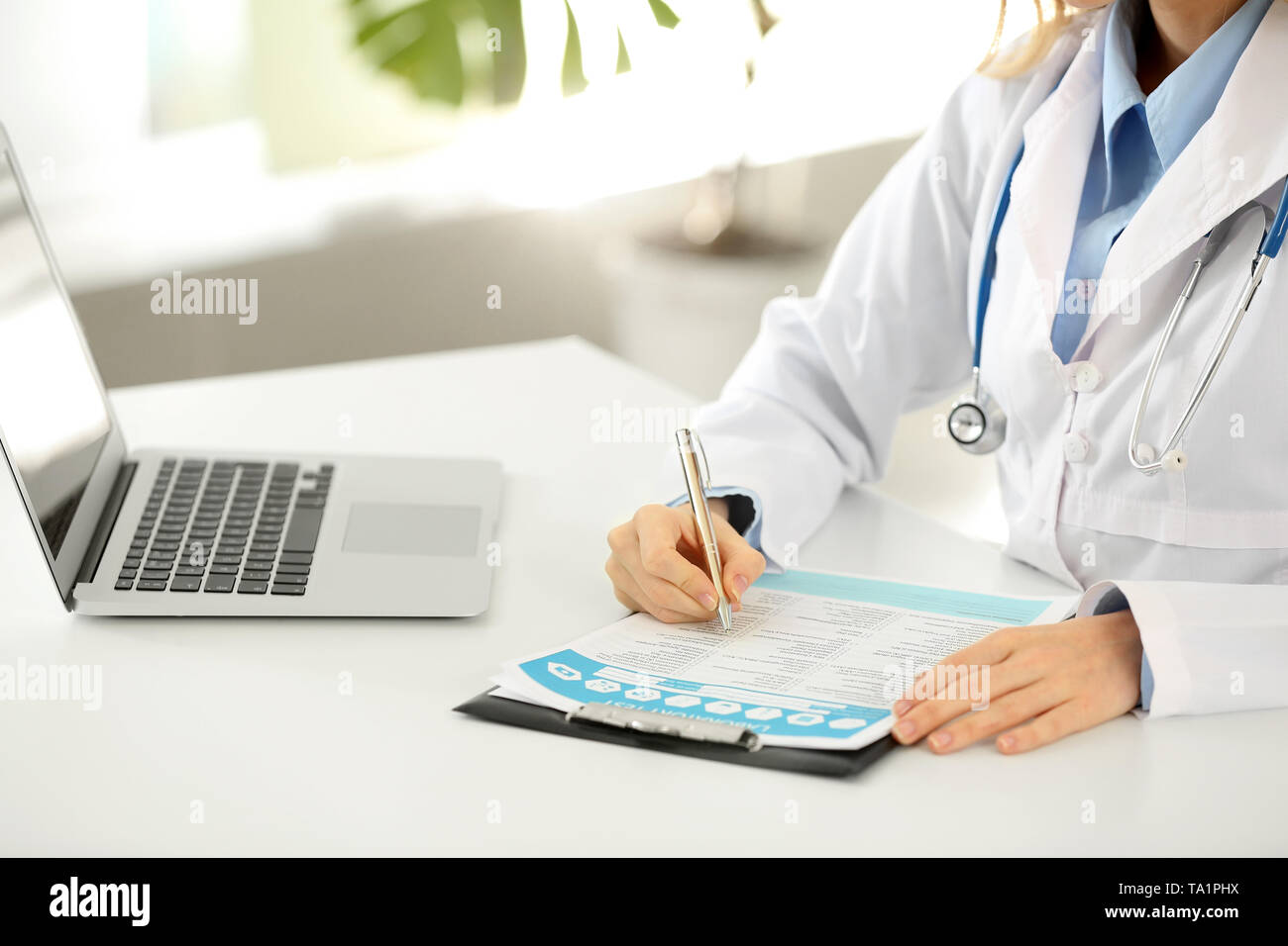 Female doctor working in clinic Stock Photo - Alamy