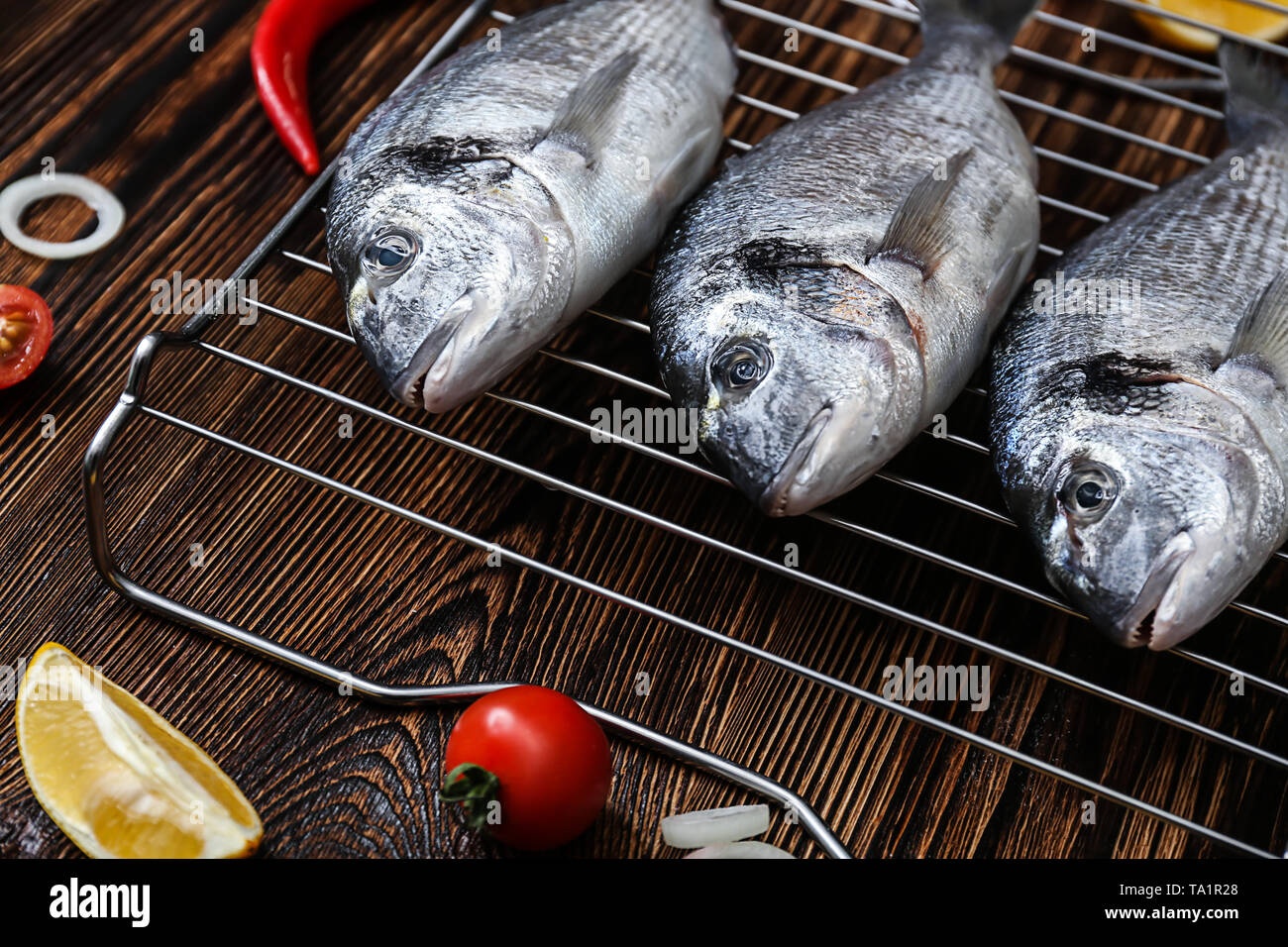 Fresh dorado fish on grill Stock Photo - Alamy