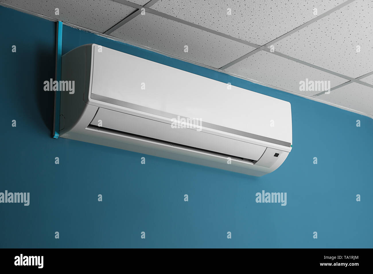 Modern air conditioner on wall Stock Photo - Alamy