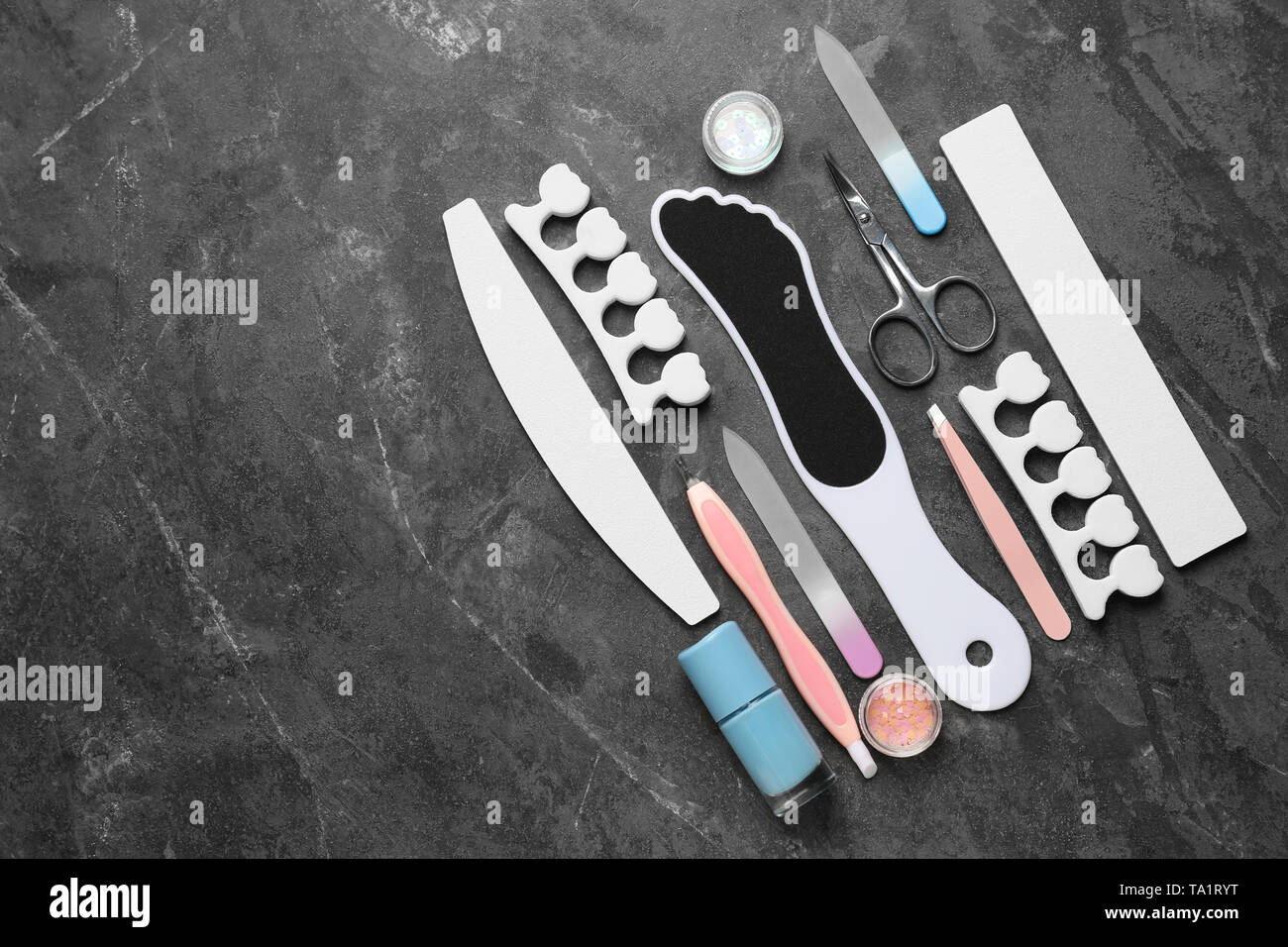 Set of professional tools for pedicure on grey background Stock Photo ...