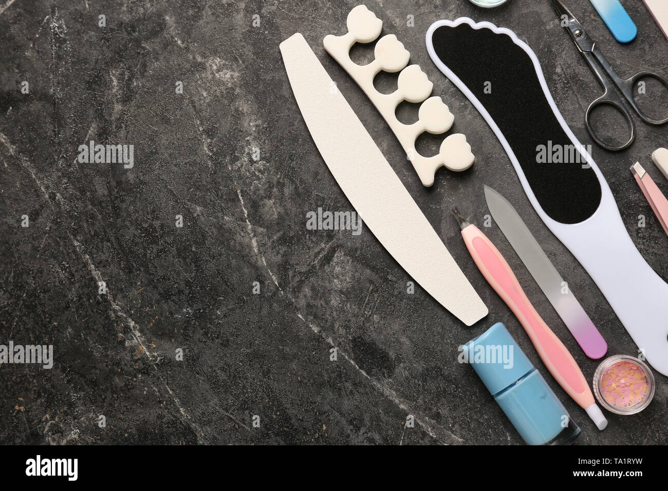Set of professional tools for pedicure on grey background Stock Photo ...