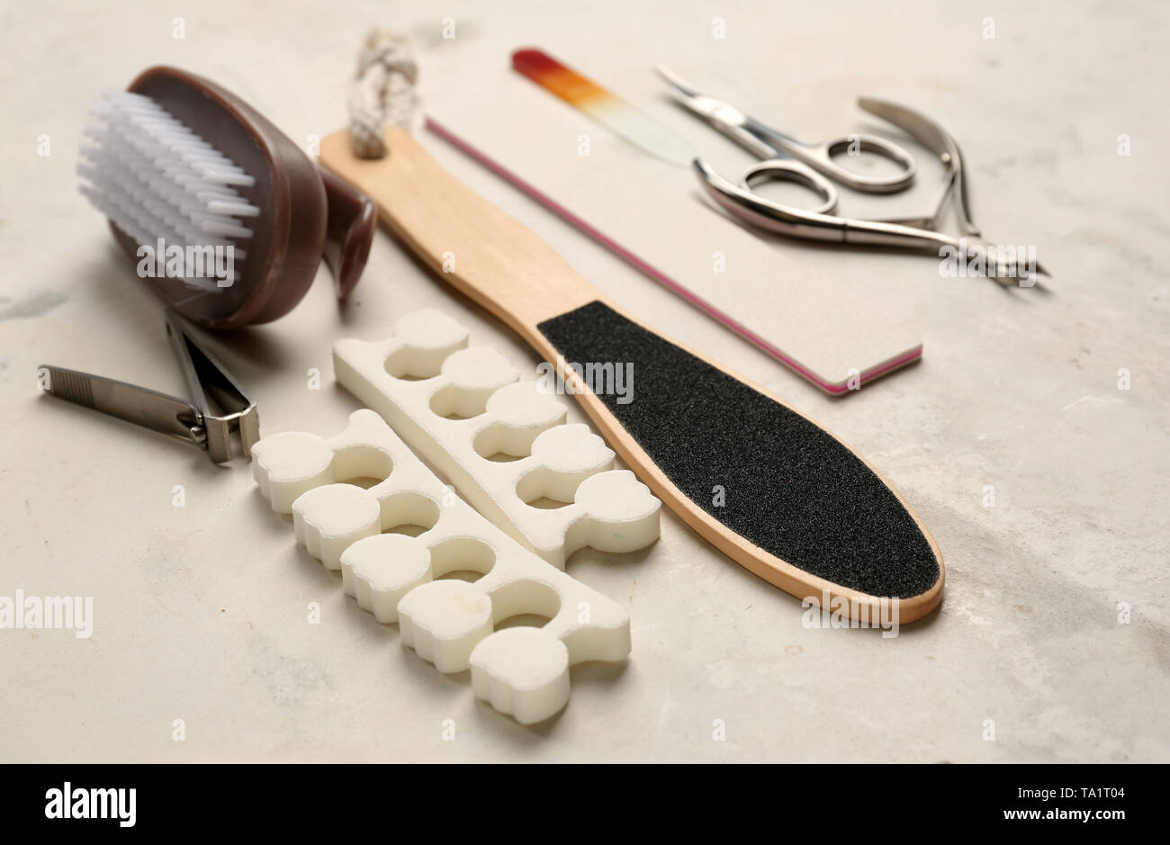 Set of professional tools for pedicure on light background Stock Photo ...