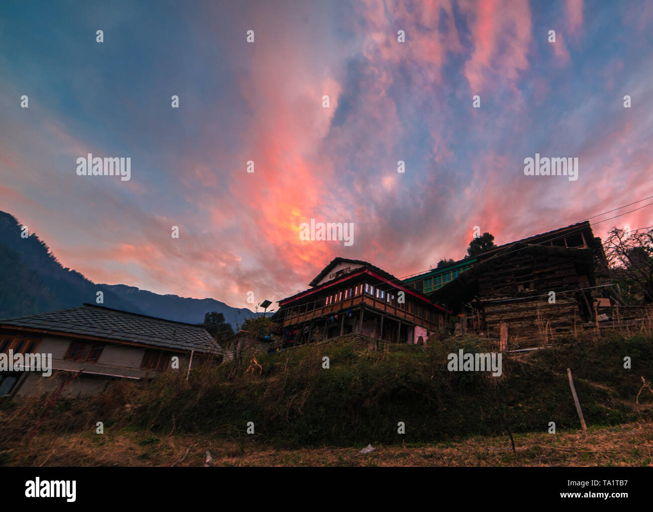 Sunset over traditional wooden house, Amazing scene with Himalayan ...