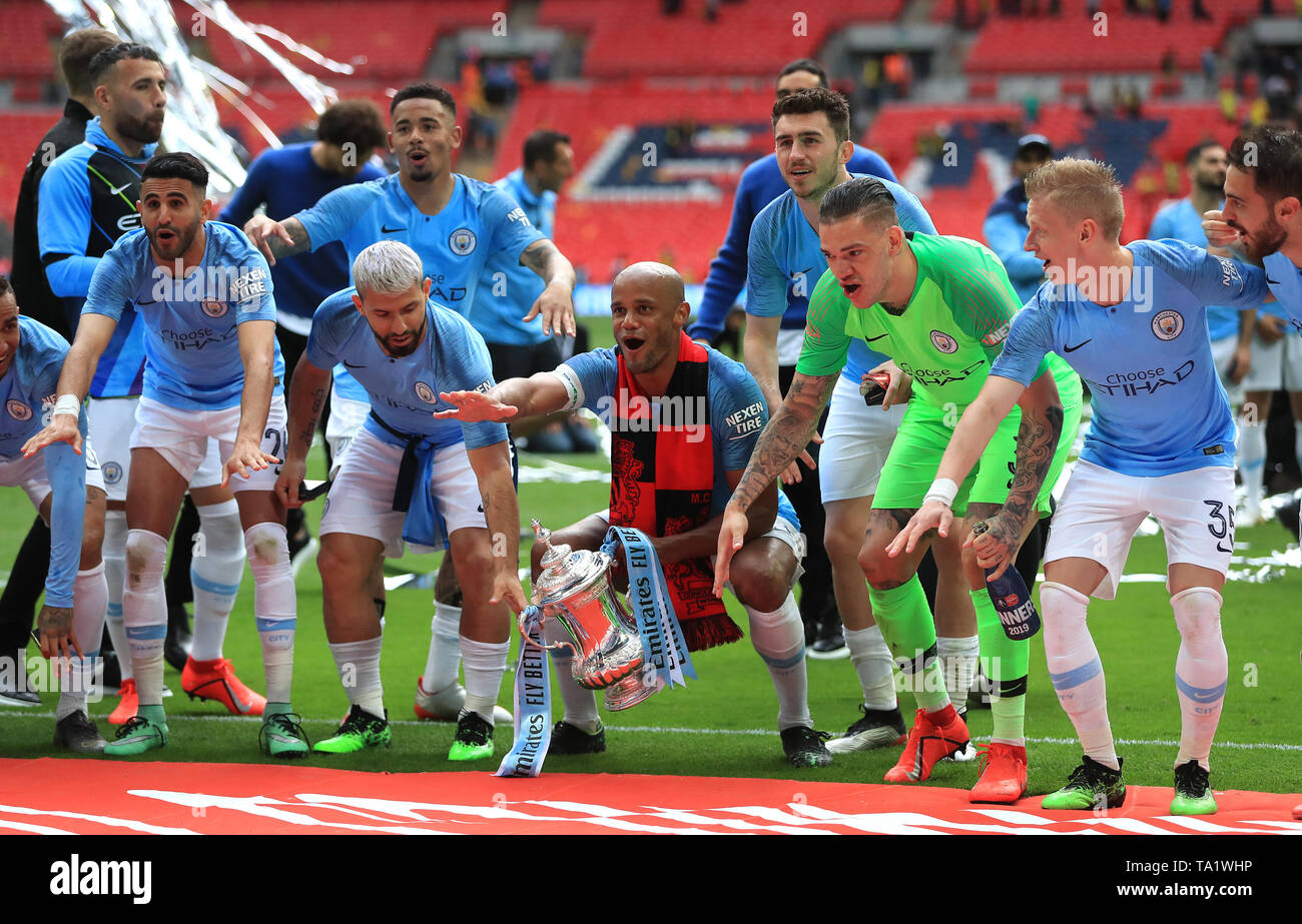 Manchester City's Vincent Kompany (centre) celebrates with the trophy ...