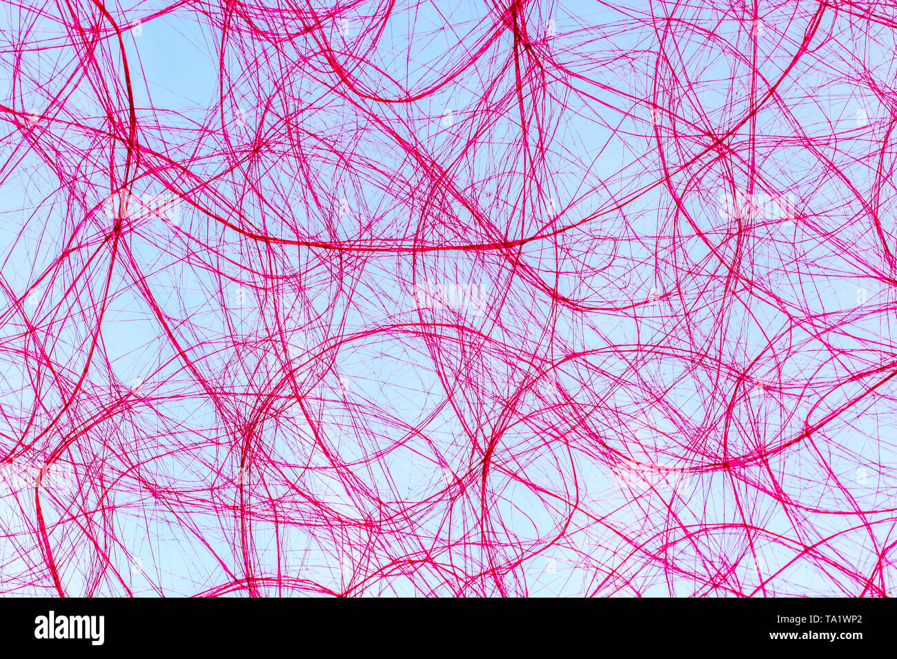 Texture of red threads with blue background Stock Photo - Alamy
