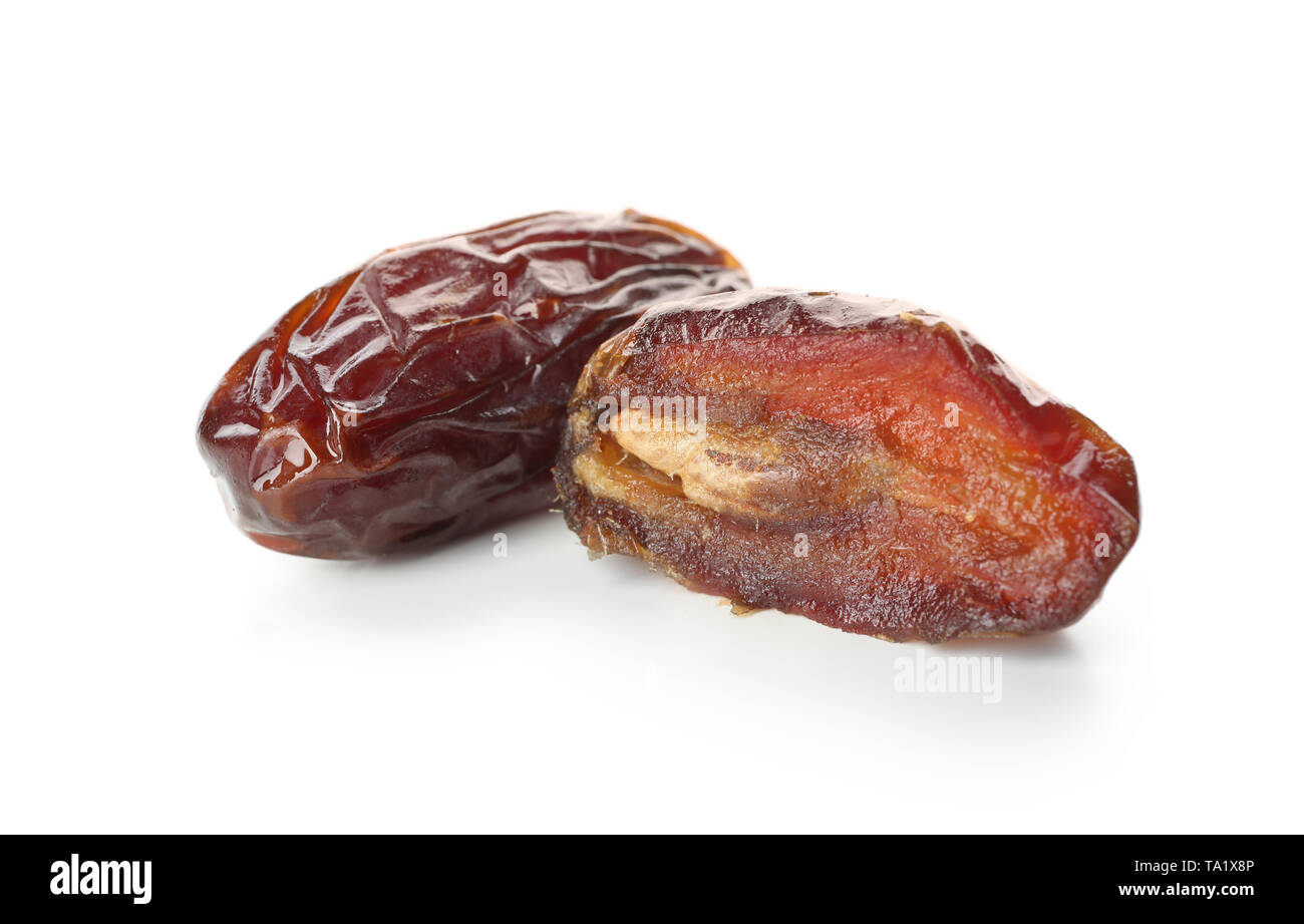 Sweet dried dates on white background Stock Photo - Alamy