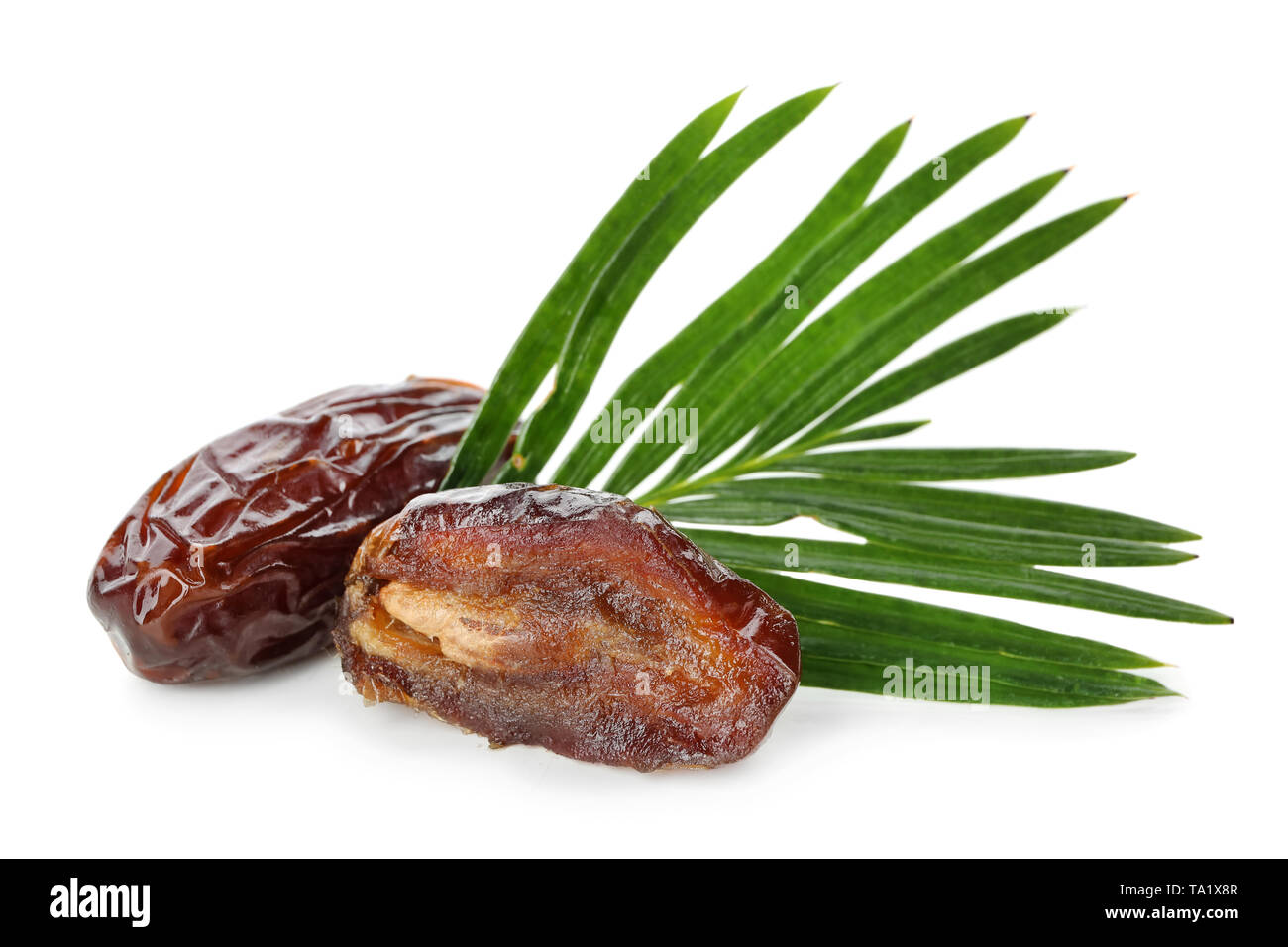 Sweet dried dates on white background Stock Photo - Alamy