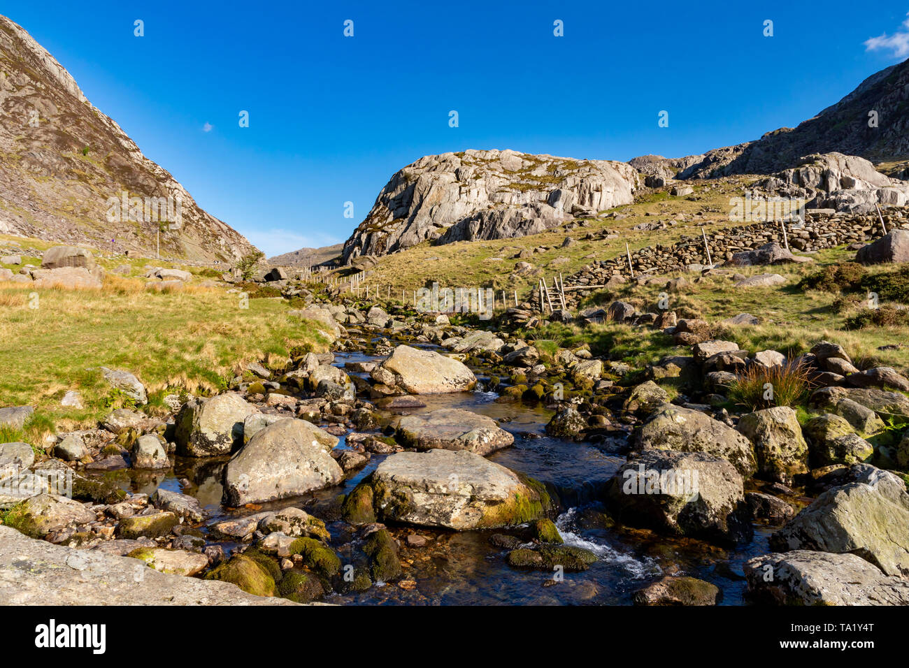 Llanberis Pass Gwnedd Wales May 13, 2019 A rocky, mountain stream flows ...