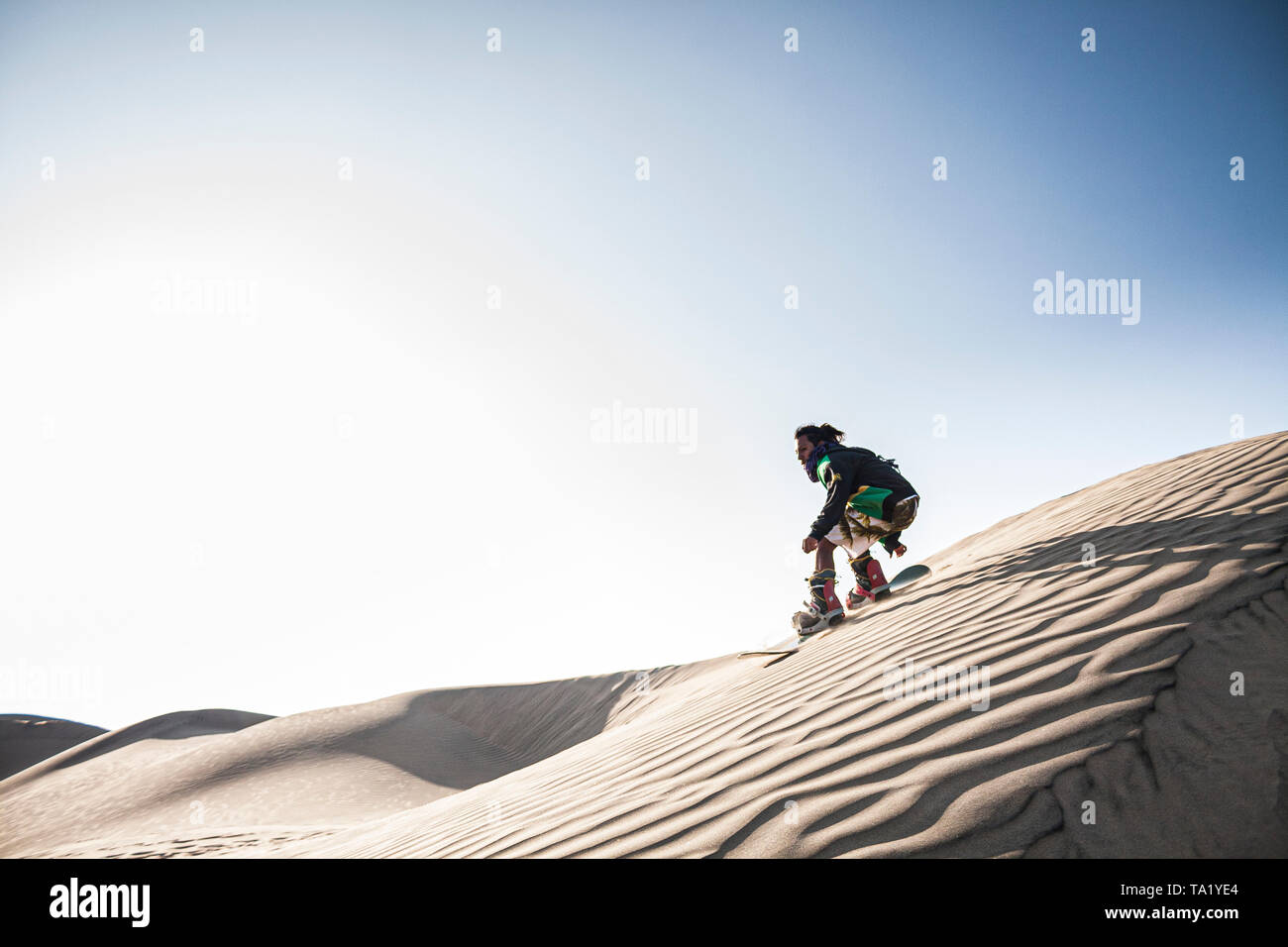 Sandboarding on Huacachina Desert. Ica, Department of Ica, Peru Stock ...