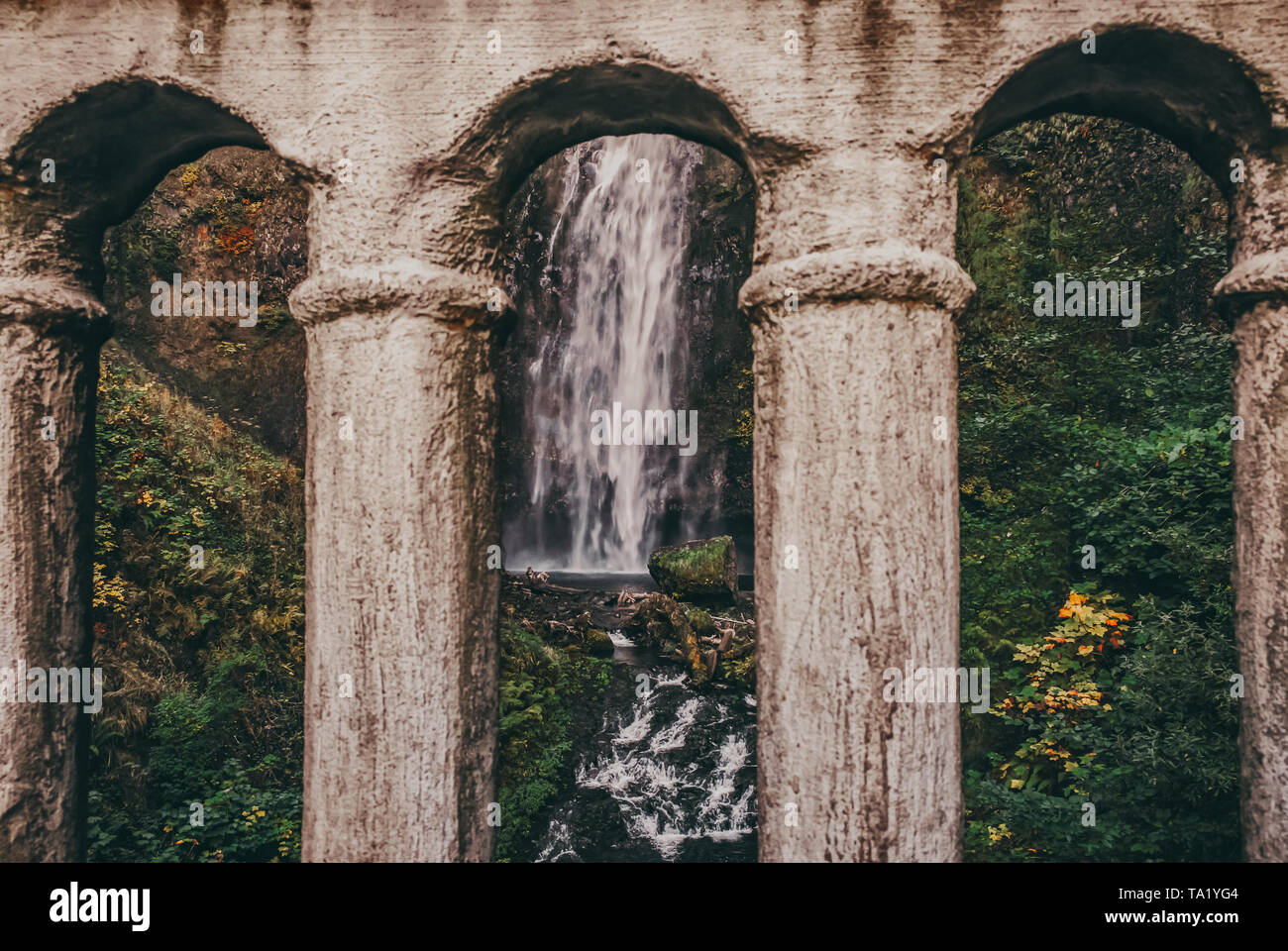 A view of Multnomah Falls through Benson Bridge in the fall, in the ...