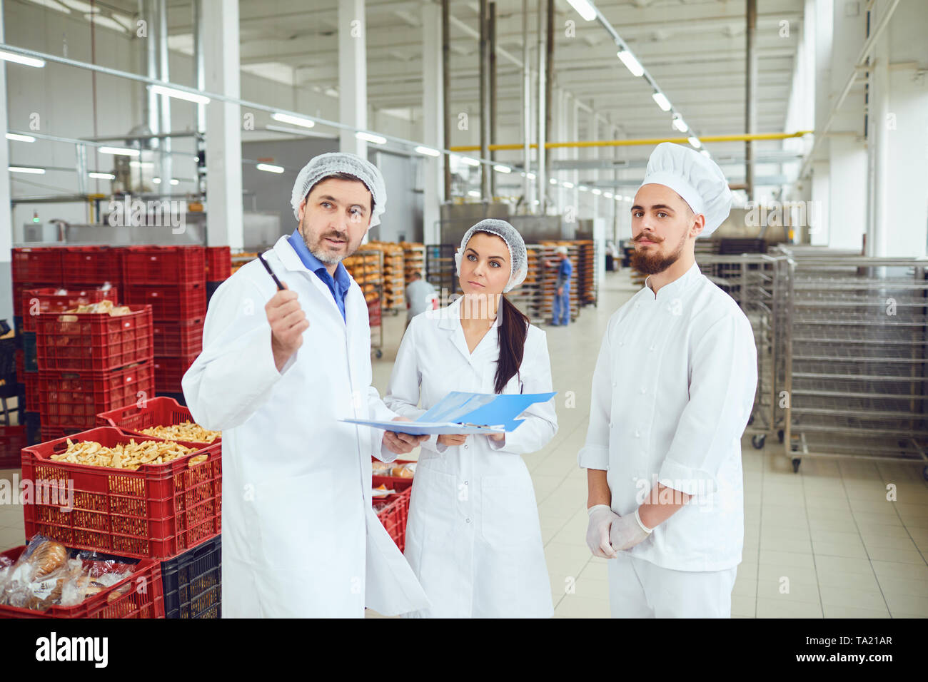 The production supervisor does the inspection at the warehouse at the ...