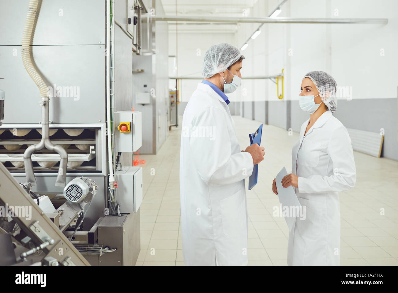 People technologists inspector in masks at food factory Stock Photo - Alamy
