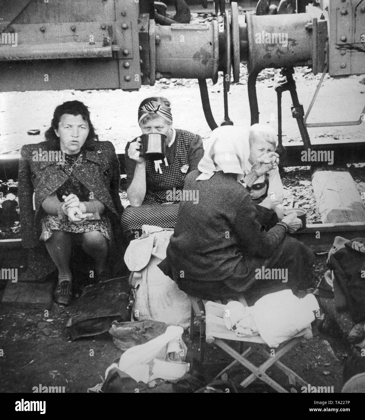 World War II, Eastern Front, refugees rest with their belongings next ...