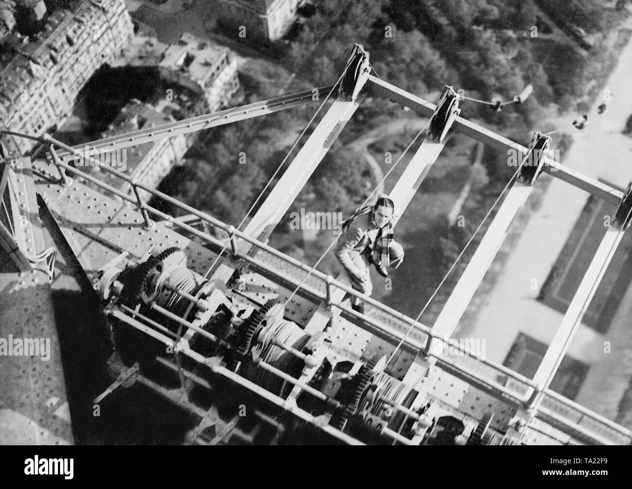 The French director Rene Clair at the Eiffel Tower filming the "La Tour ...