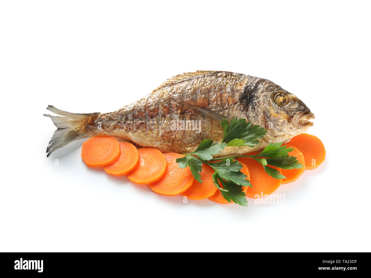 Grilled dorado fish with carrot on white background Stock Photo - Alamy