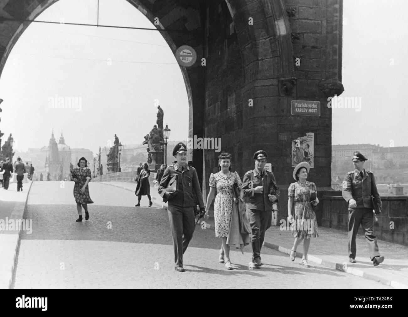 Soldiers of the Wehrmacht march across the Charles Bridge in Prague ...