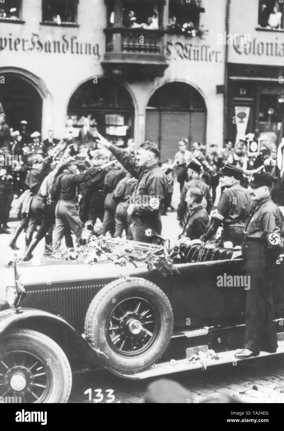 Adolf Hitler and Rudolf Hess (2nd from right) take the salute of the SA ...