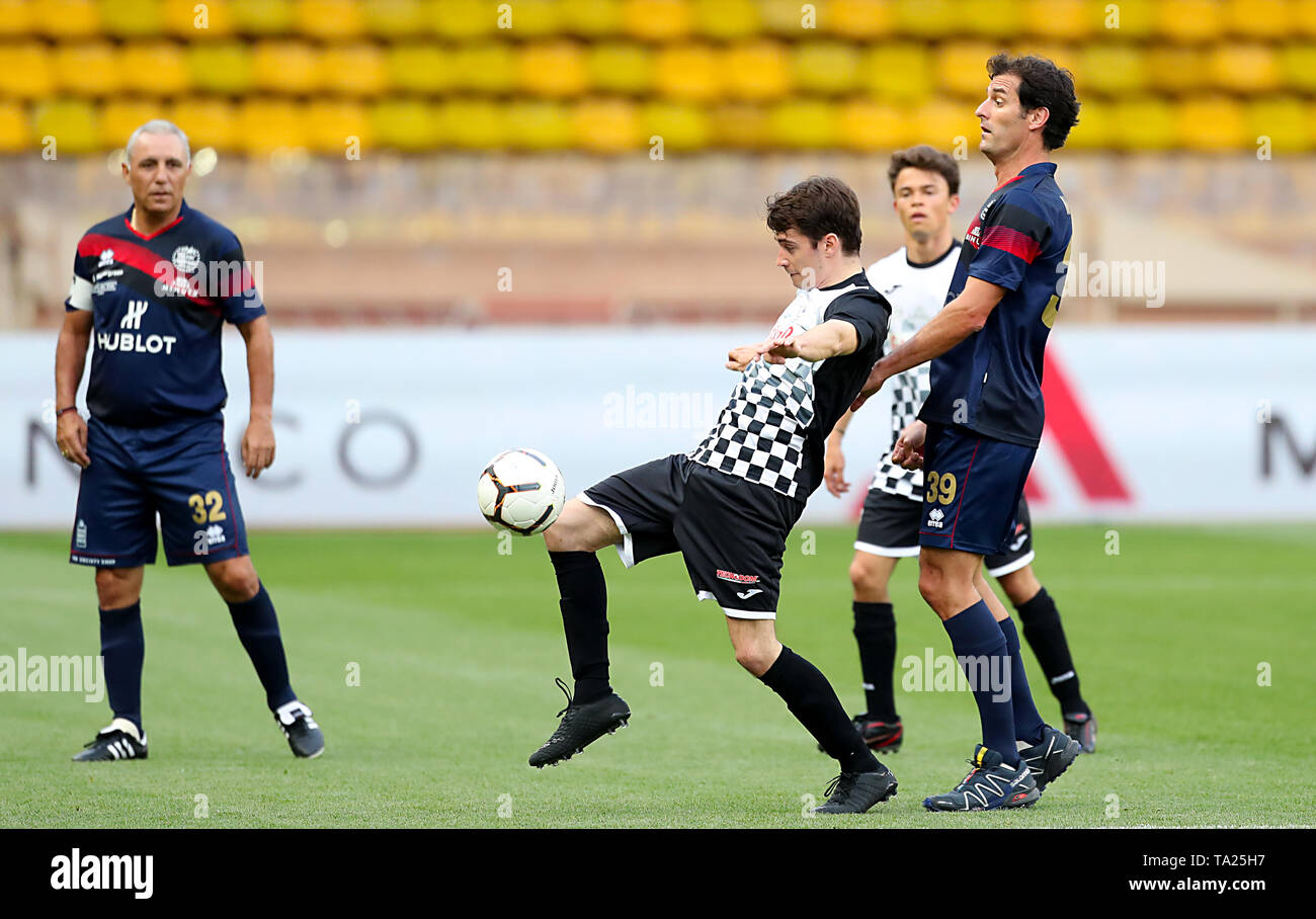 Charles Leclerc (left) and Mark Webber battle for the ball during the ...