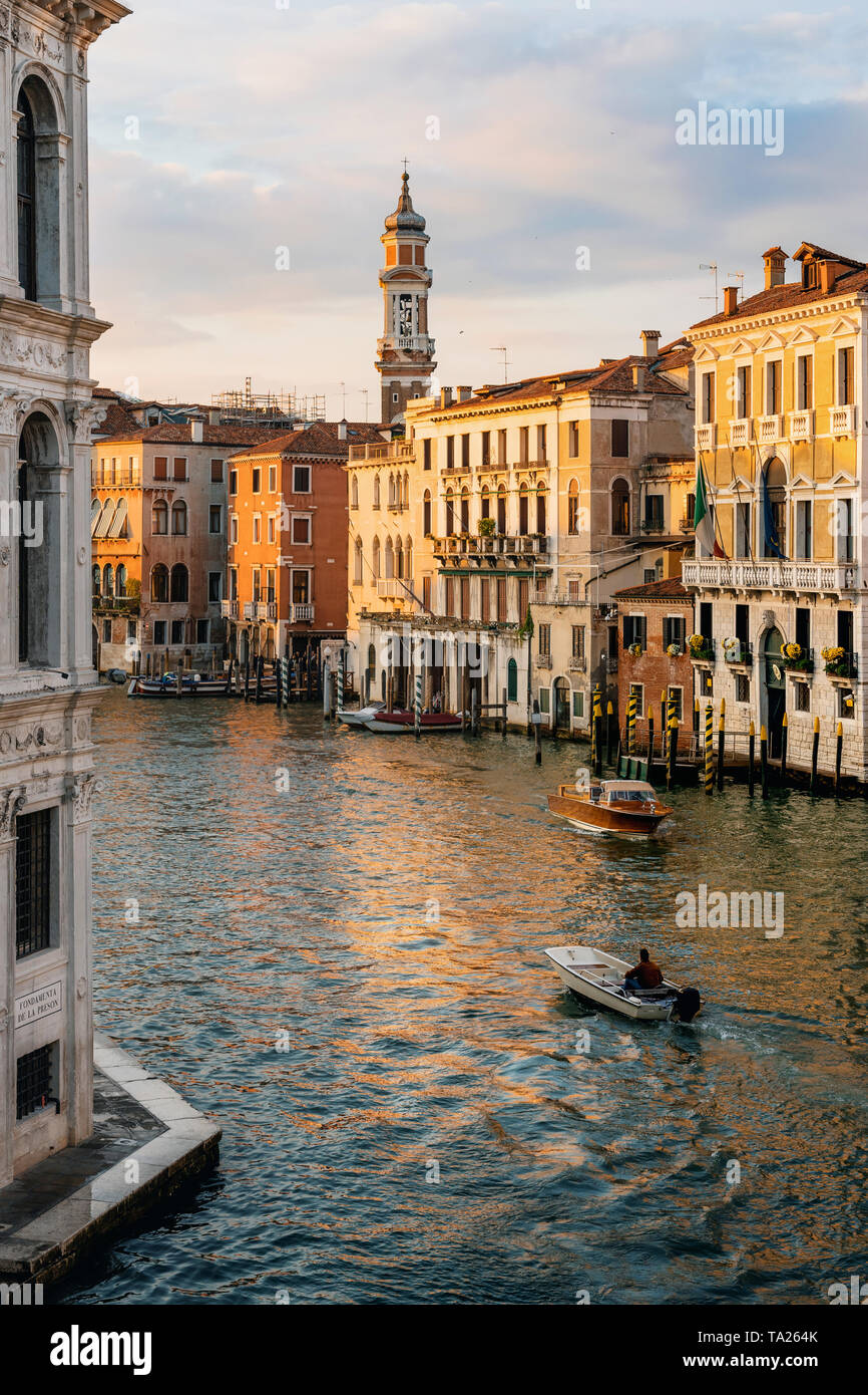 Gondolas and boats float on Grand Canal at sunset in Venice, Italy ...