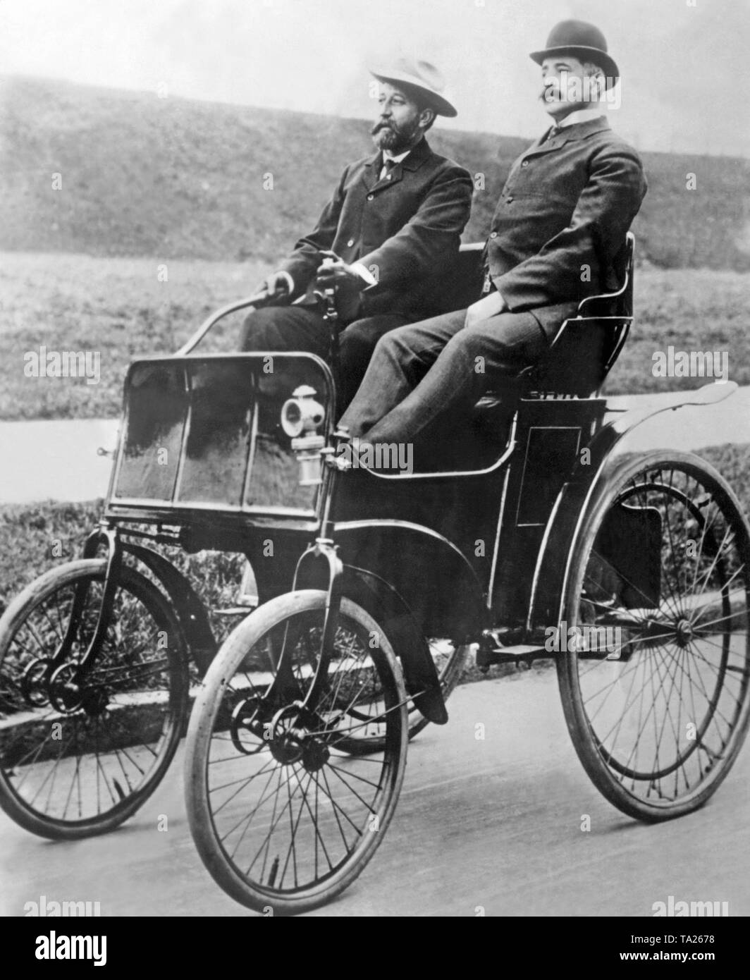 Two men on a Stahlradwagen ( "steel-wheeled car") from the late 19th ...