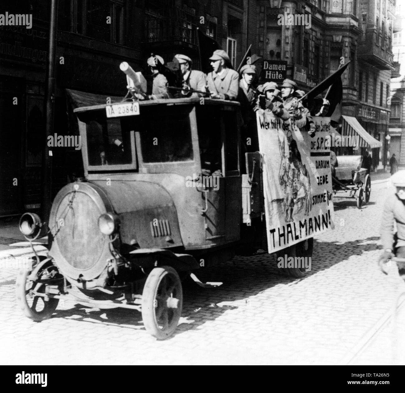 Propaganda car of the KPD with a banner displaying the name of chairman ...