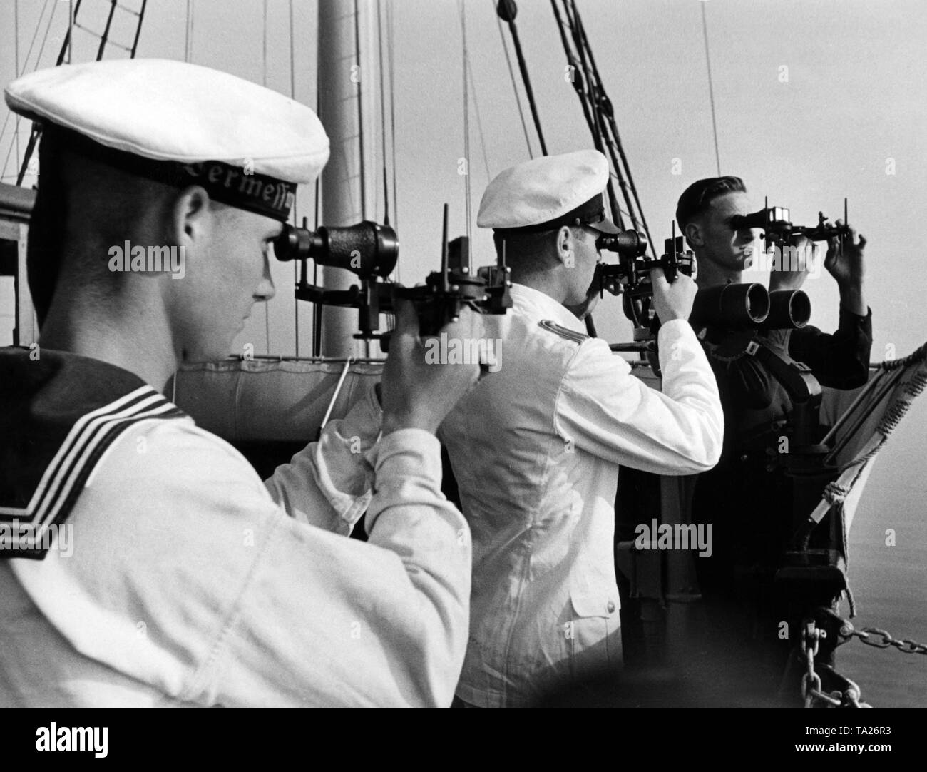 The surveying officer and surveying staff measuring angles Stock Photo ...