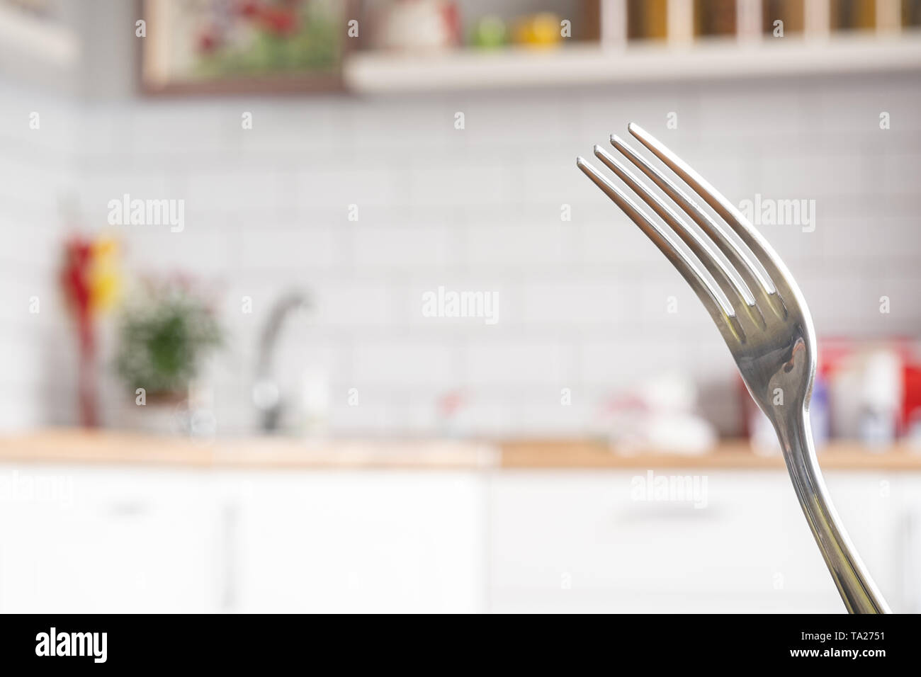 fork on the background of the kitchen. Blur abstract background modern ...