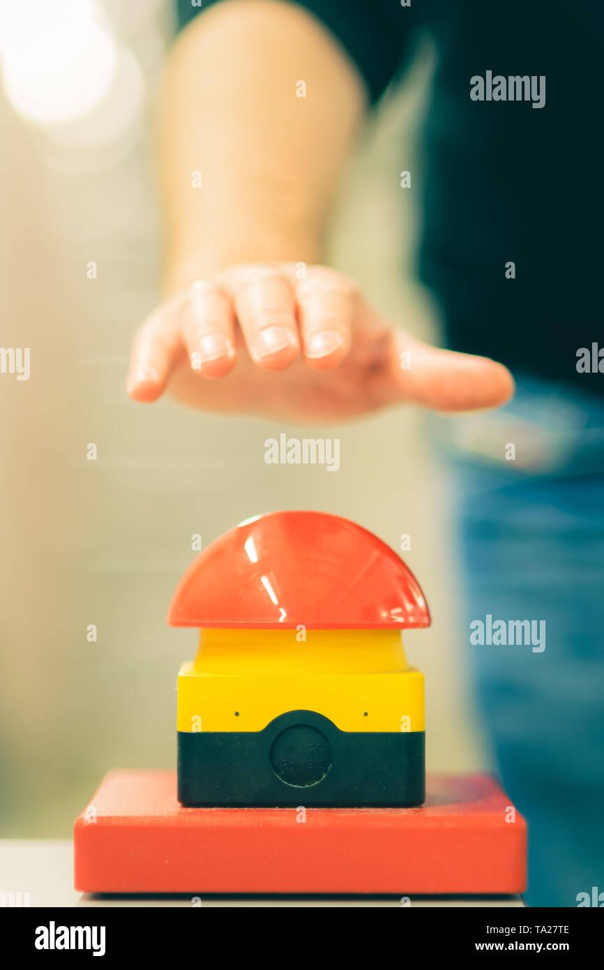 Hand pressing emergency stop button hi-res stock photography and images ...
