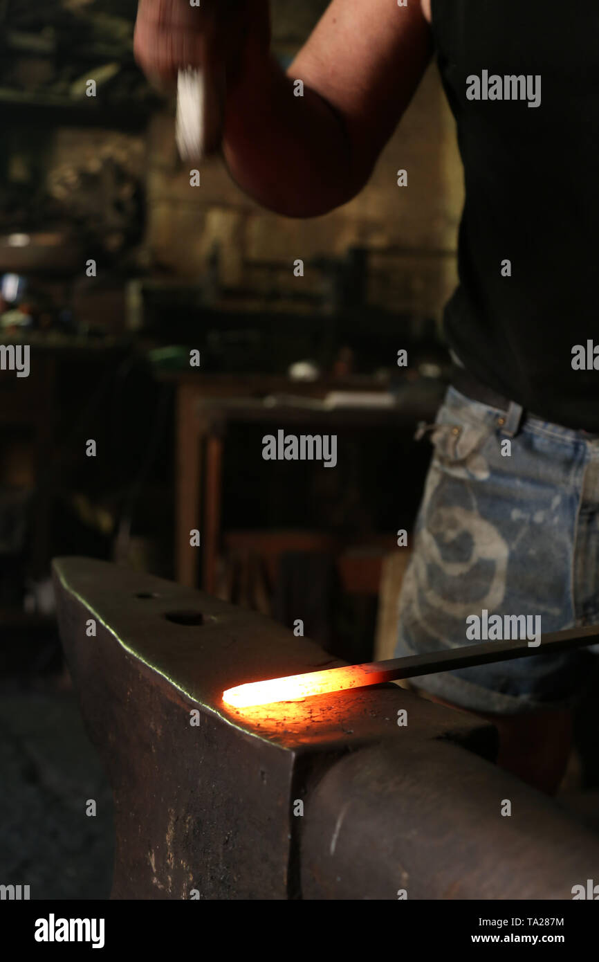 Blacksmith beating the iron, Gozo, Malta Stock Photo - Alamy
