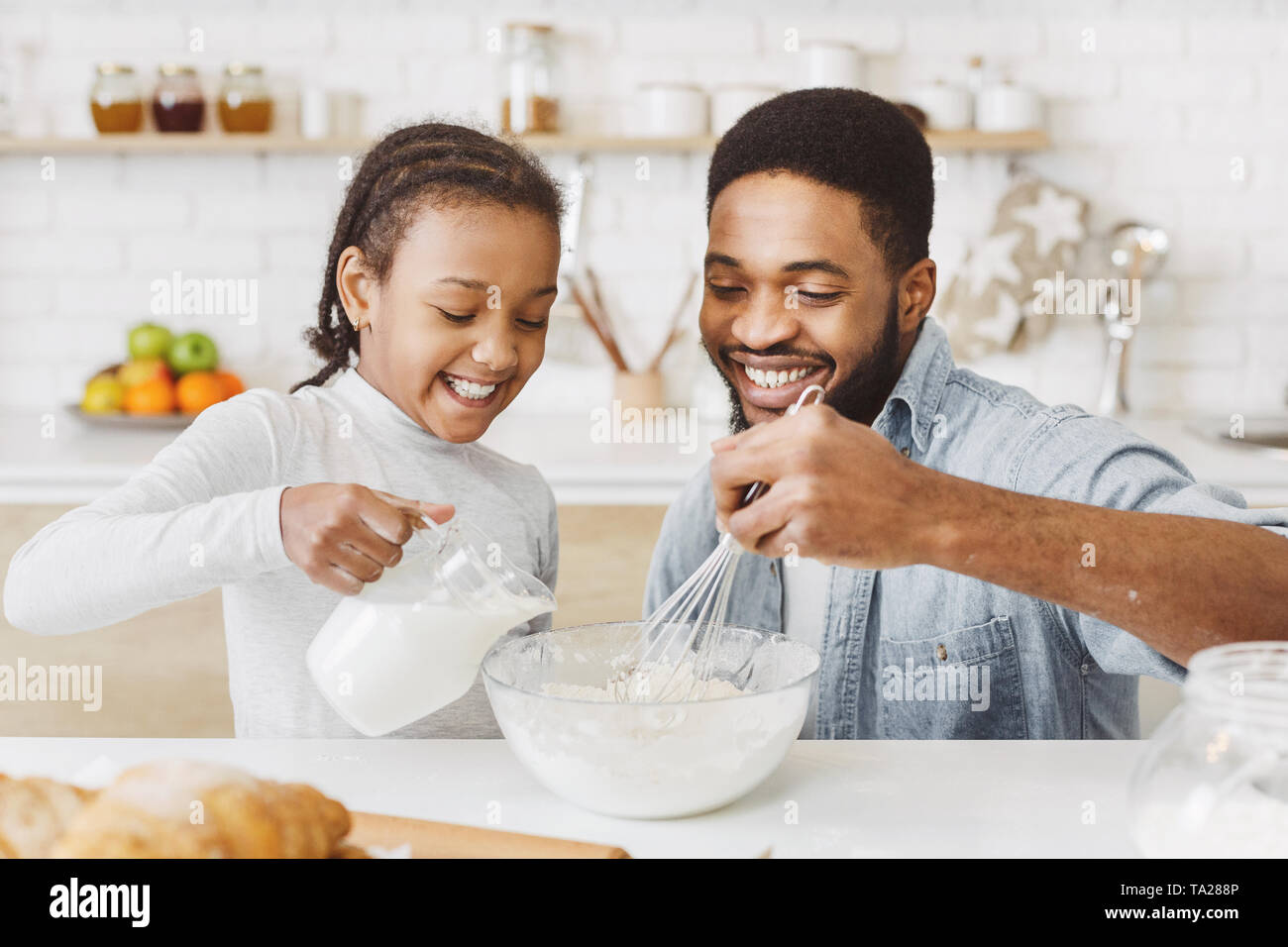 Father and daughter cooking together Stock Photo - Alamy