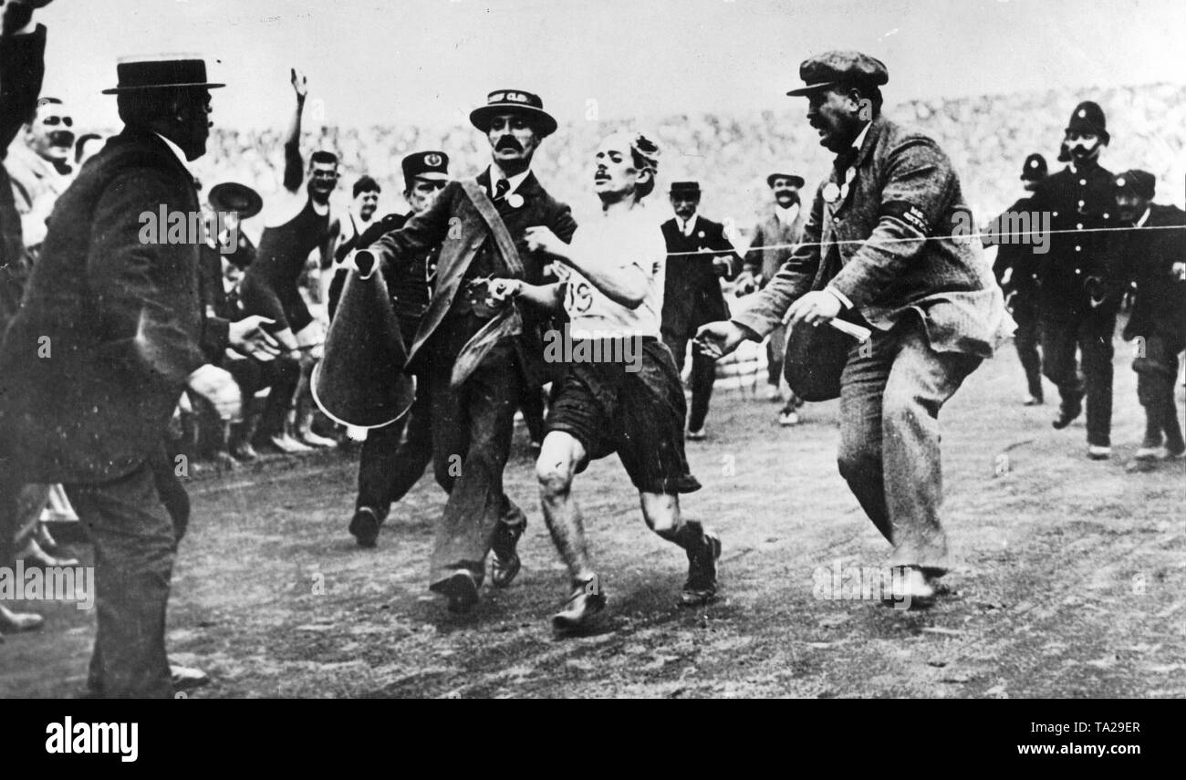 The italian athlete finishing his marathon at the olympic games in ...