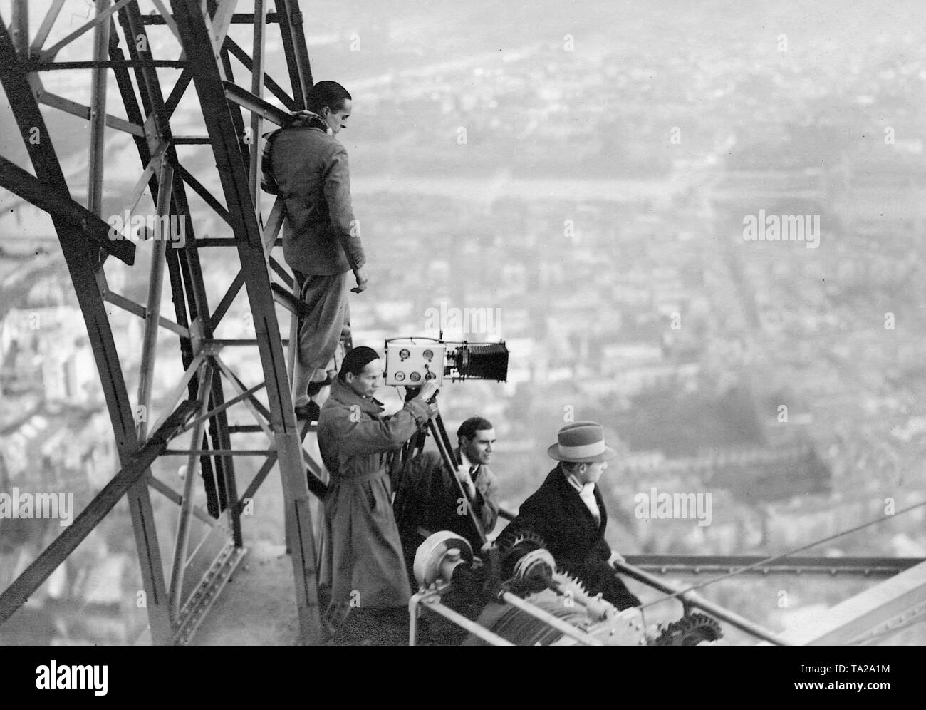 The French director Rene Clair at the Eiffel Tower filming the "La Tour ...