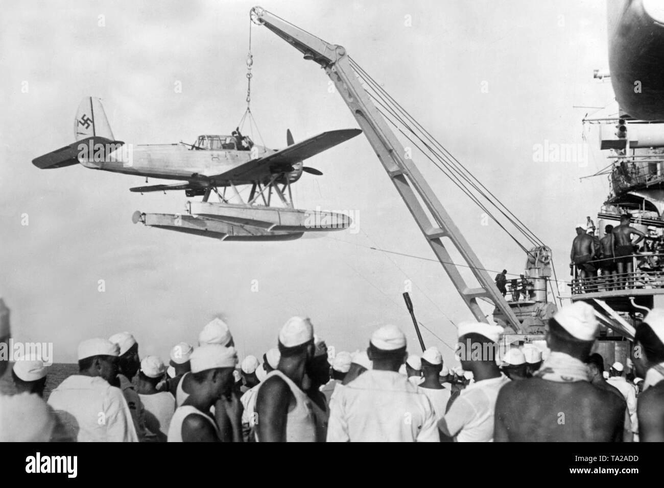 An Arado Ar 196 seaplane is lifted with a crane back on board a German ...