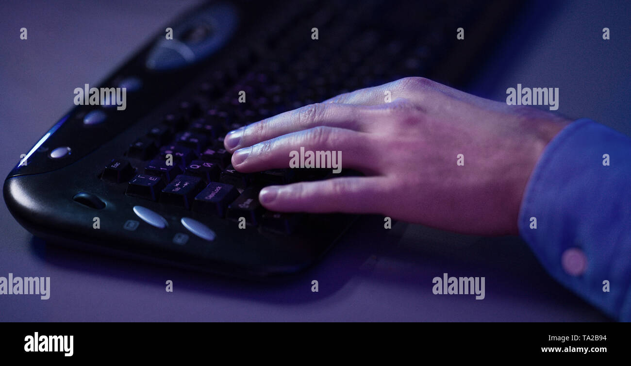 Playing Games Online. Gamer Hand On Keyboard Stock Photo - Alamy