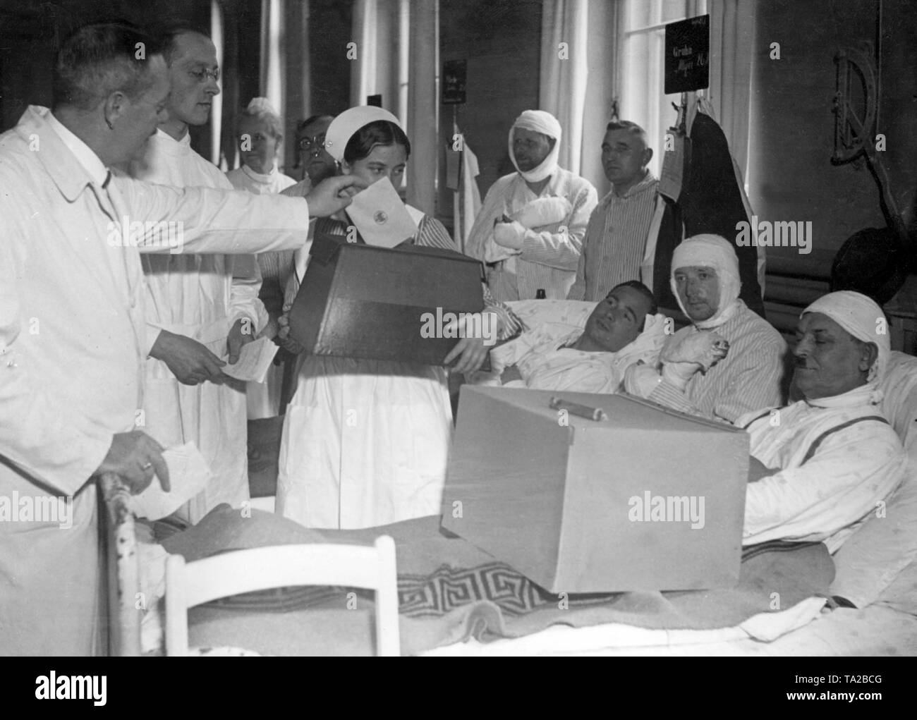 Nurses and doctors help patients to cast their vote Stock Photo - Alamy