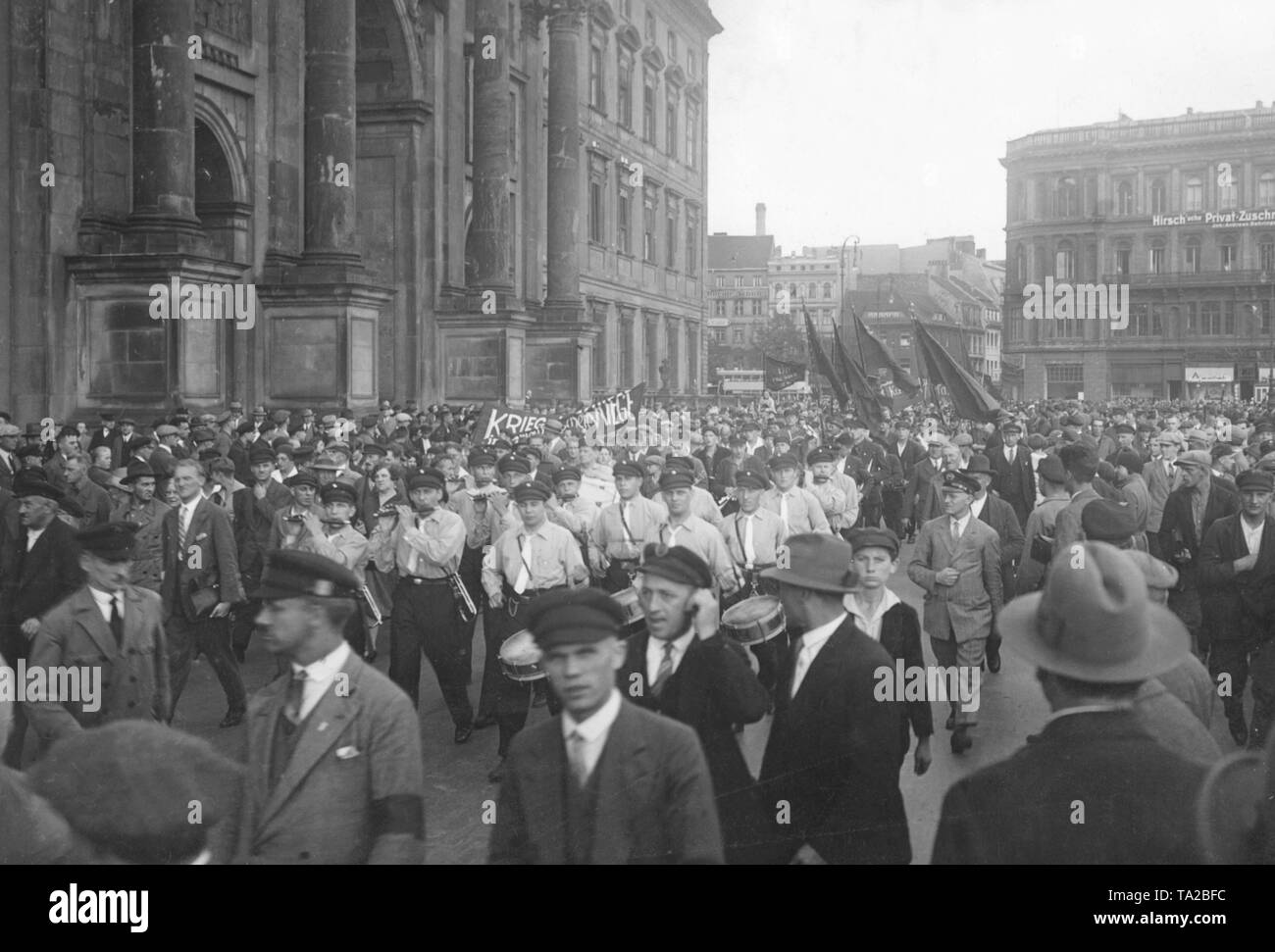 Members of the Communist Party with flags, banners and a uniformed ...