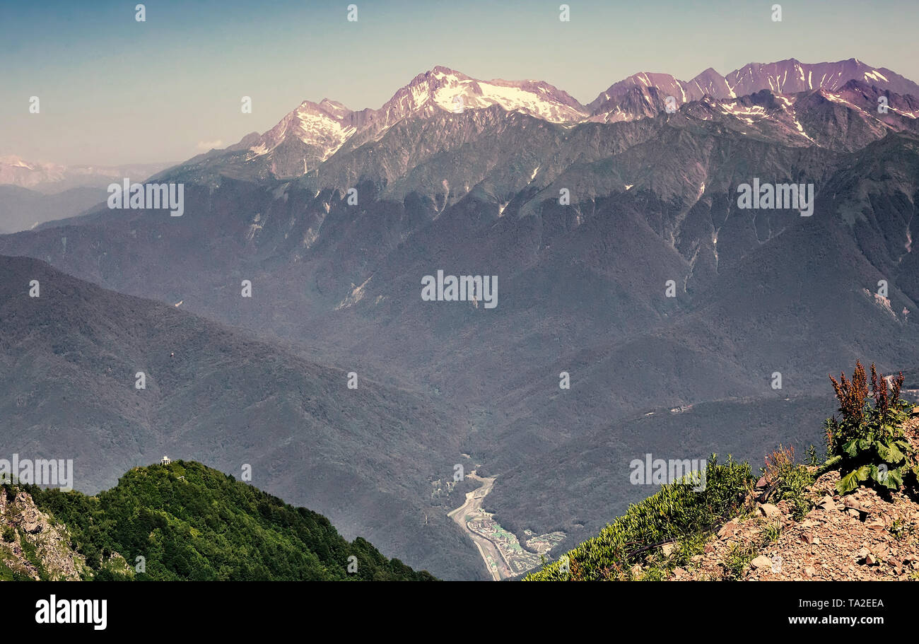 Mountain landscape: steep mountains covered with forests, form a deep ...
