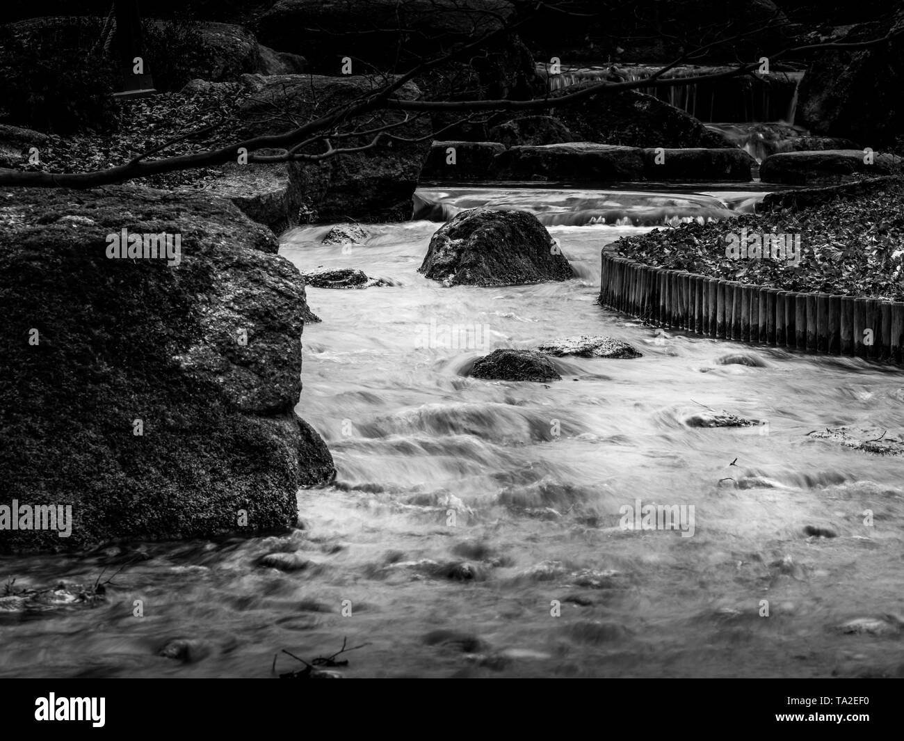 Long exposure image of running river in bautiful japanese garden setup ...