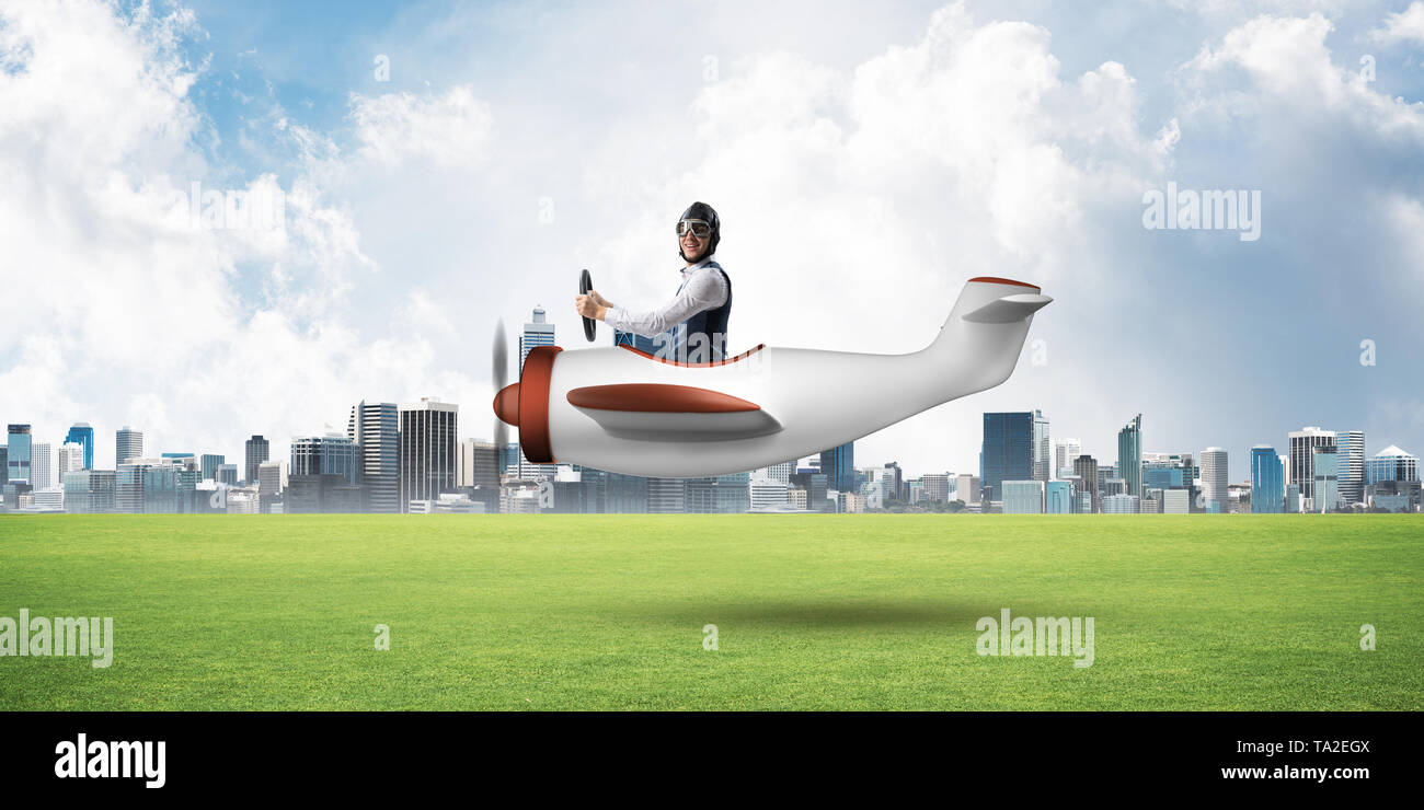 Young aviator driving small propeller plane Stock Photo - Alamy