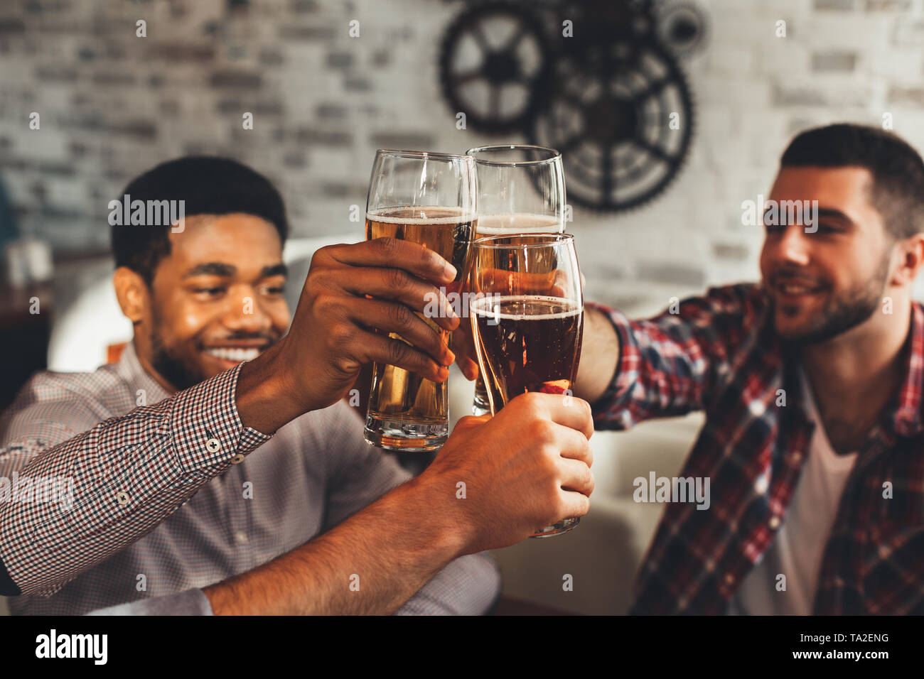 Celebrating Meeting. Diverse Friends Drinking Beer In Bar Stock Photo ...