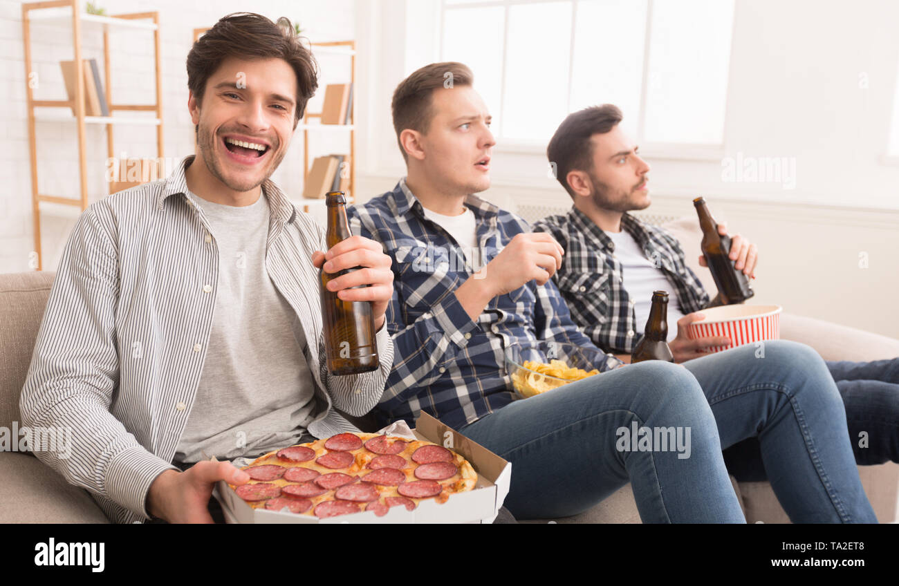 Mates Spending Time Together, Eating Pizza And Watching Film Stock ...